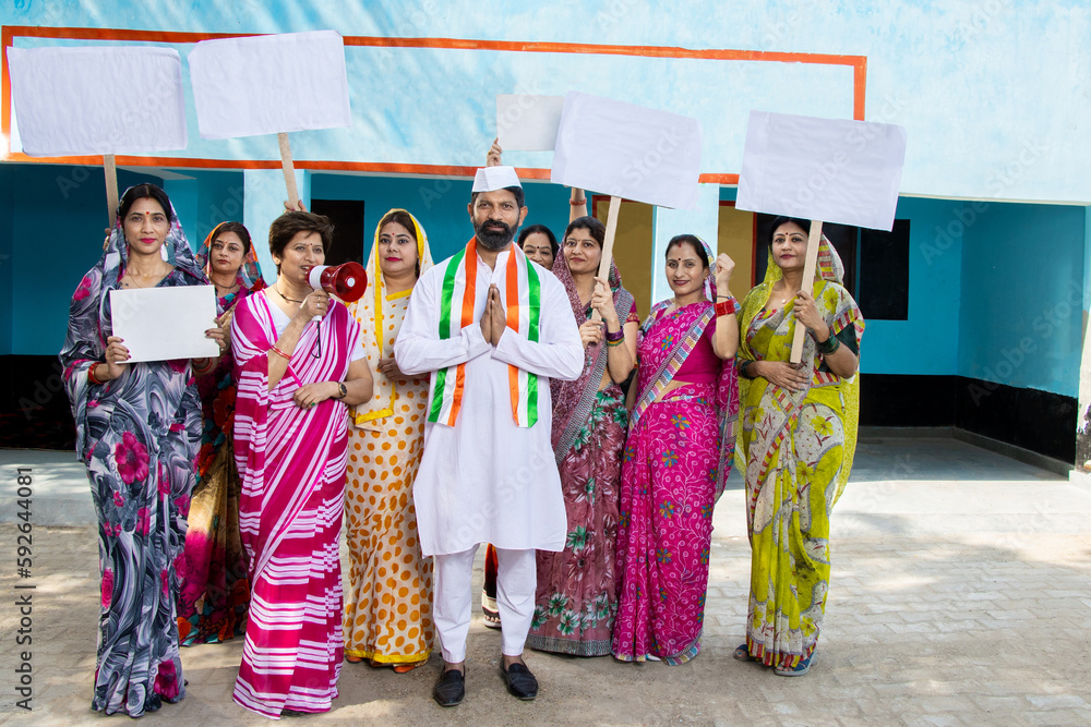 Indian man politician standing doing namaste with group of traditional ...