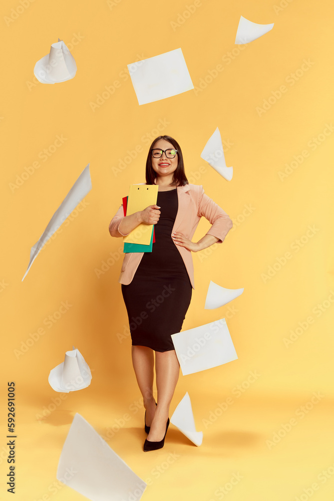 Fotka „Finished tasks. Portrait of happy, young, smiling, asian girl in ...