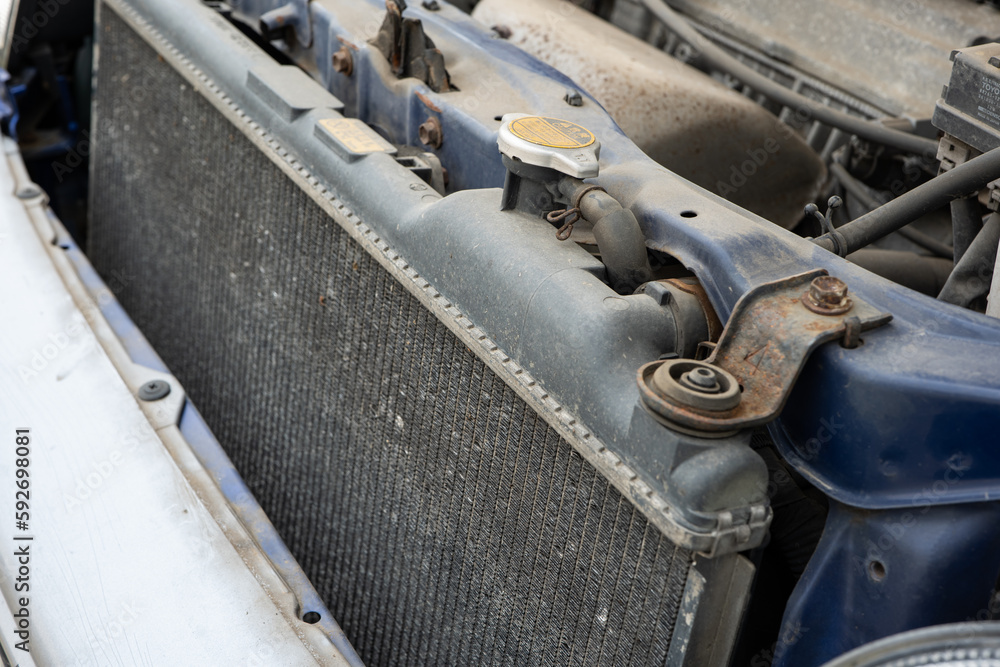 Old rusty car radiator grill with accumulated dirt and small dents ...