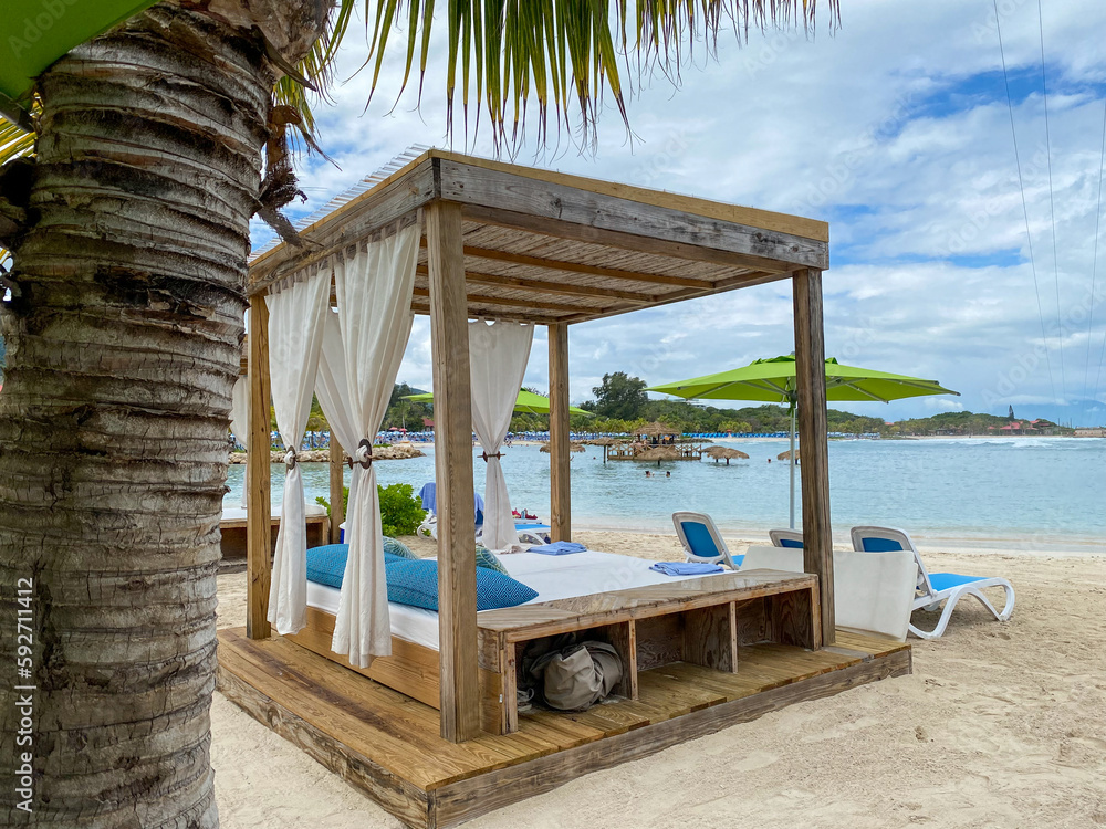 Beach cabanas overlooking the Caribbean Sea. Relax in the shade. Beach, sand, umbrellas ...