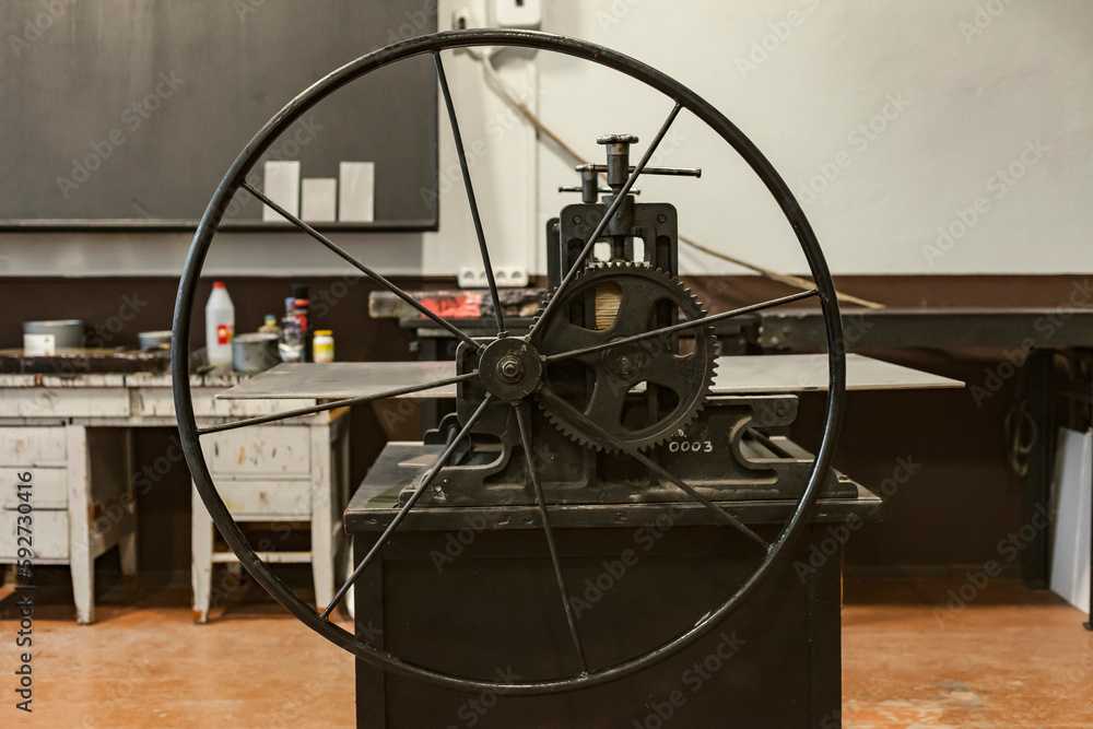 An old vintage lithographic press or rolling press used for creating ...