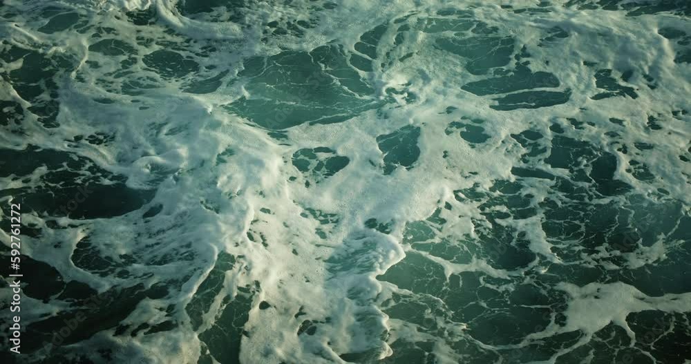 Boiling ocean waves foam water background at storm. Top down raging sea ...