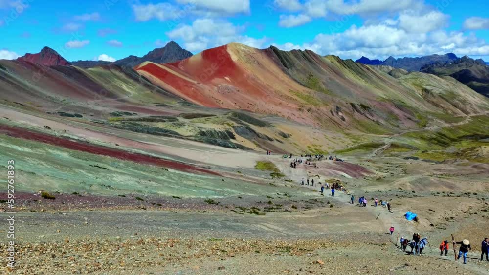 Tourists arriving in the top of Seven Colors Mountain, or Vinicunca ...