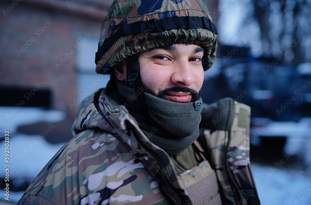 Outdoors portrait of a Ukrainian military soldier in full body armor ...