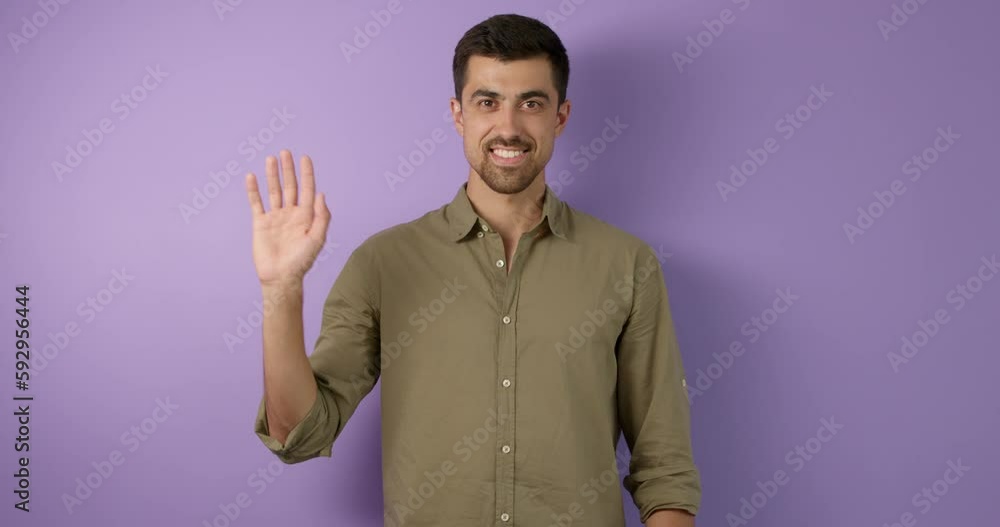 happy deaf young man greeting, saying Hello,hi making sign language ...