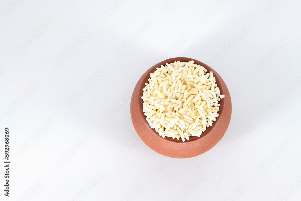 resh rice puff in mud pot and isolated in white background. Called Pori ...
