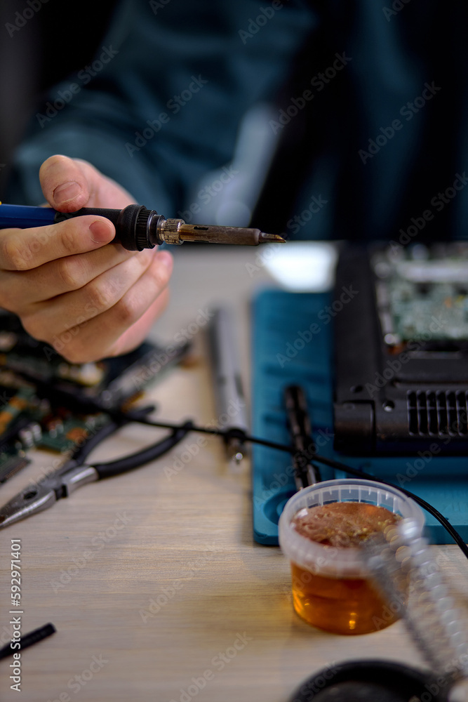 focus on special tool for laptop repair, unrecognizable engineer ...