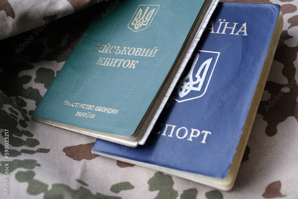 Ukrainian military ID and national passport on military uniform. The ...