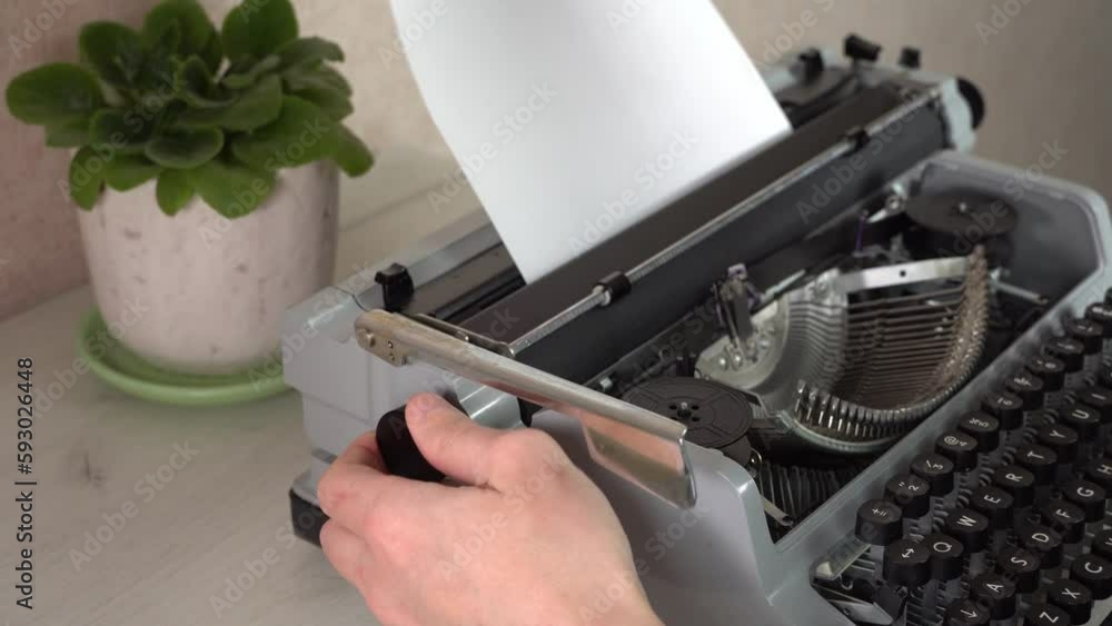 Writing a book and typing old typewriter, top view. Man typing on old ...