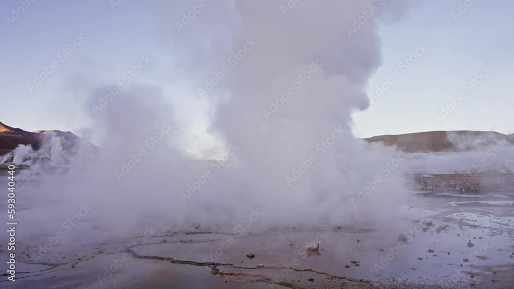 Water steam rising and water eruptions at El Tatio Geyser Field with ...