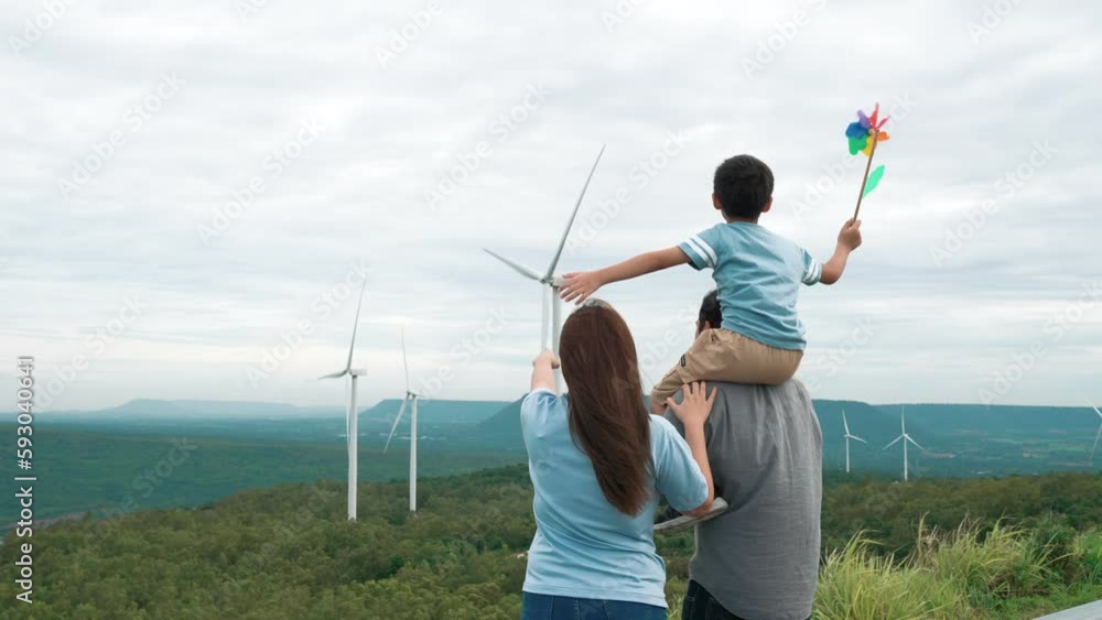 Concept of progressive happy family enjoying their time at the wind ...