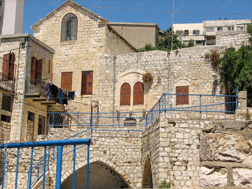 An ancient house built out of stone bricks and blocks with blue ...
