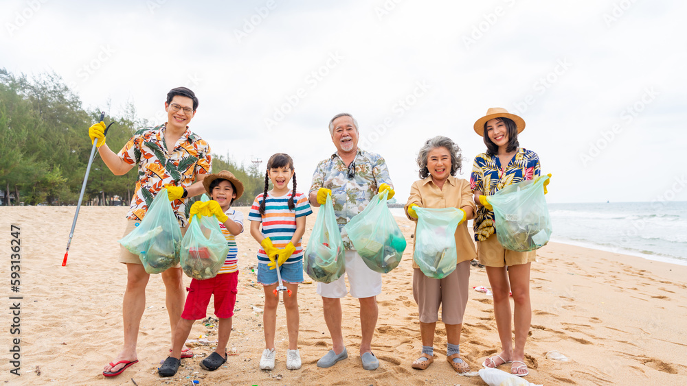 Group of Volunteers multi-Generation family picking up plastic trash ...