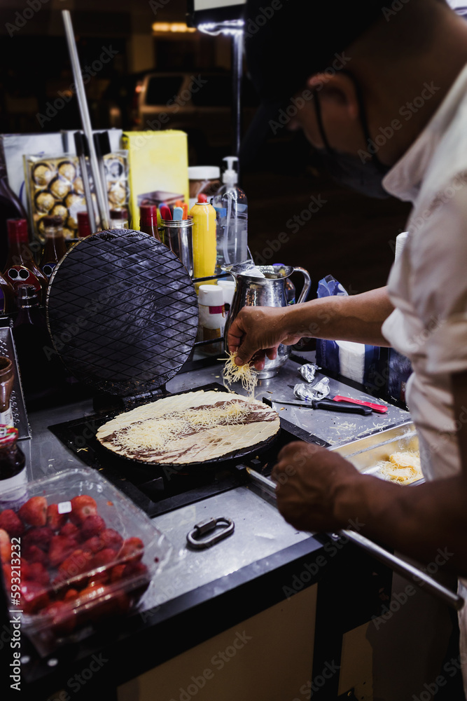 preparing Marquesitas mexican dessert traditional in Yucatan and Cancun ...