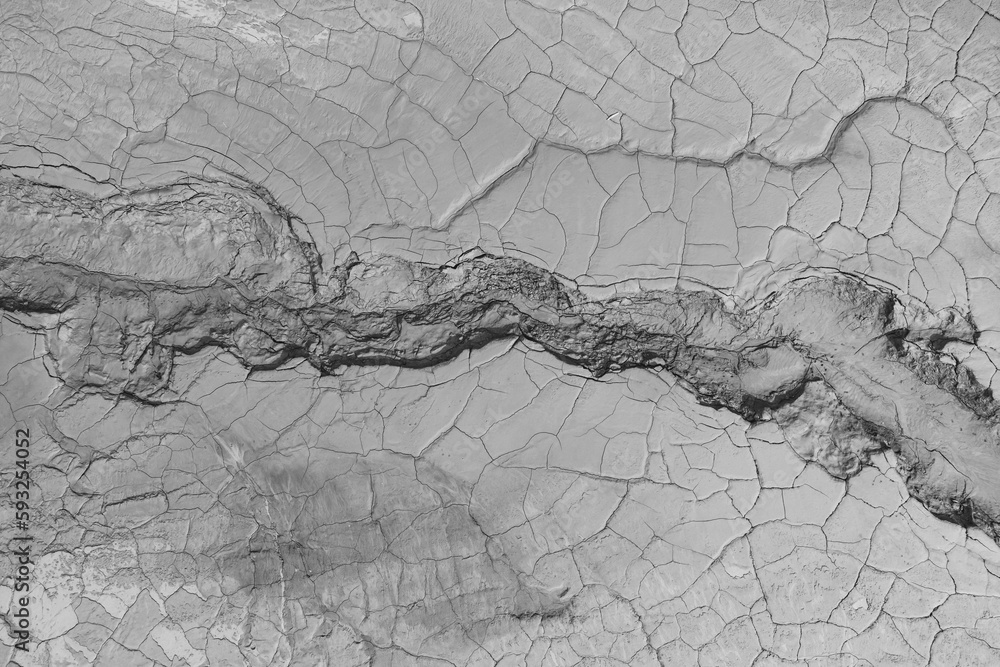 The structure of cracked wet earth at the bottom of the lake, creating ...