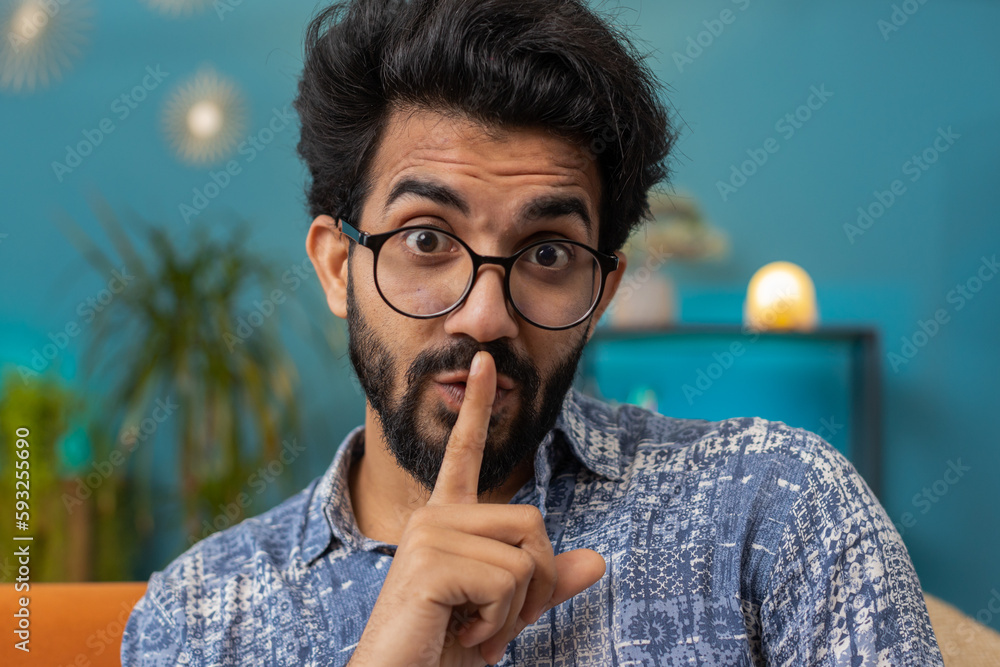 Shh be quiet, hush please. Indian man with presses index finger to lips ...