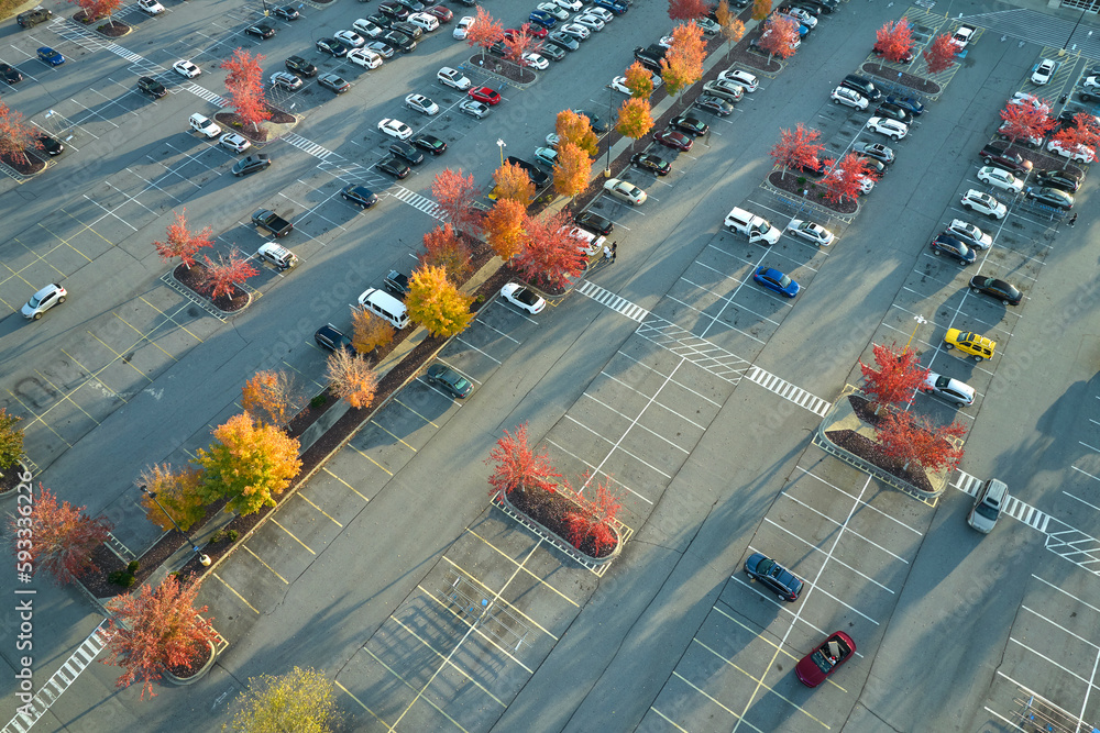 View from above of many parked cars on parking lot with lines and ...