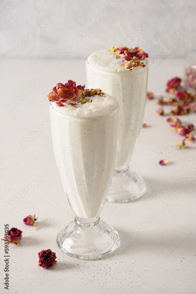 Indian Sweet lassi with saffron and rose water on white background ...