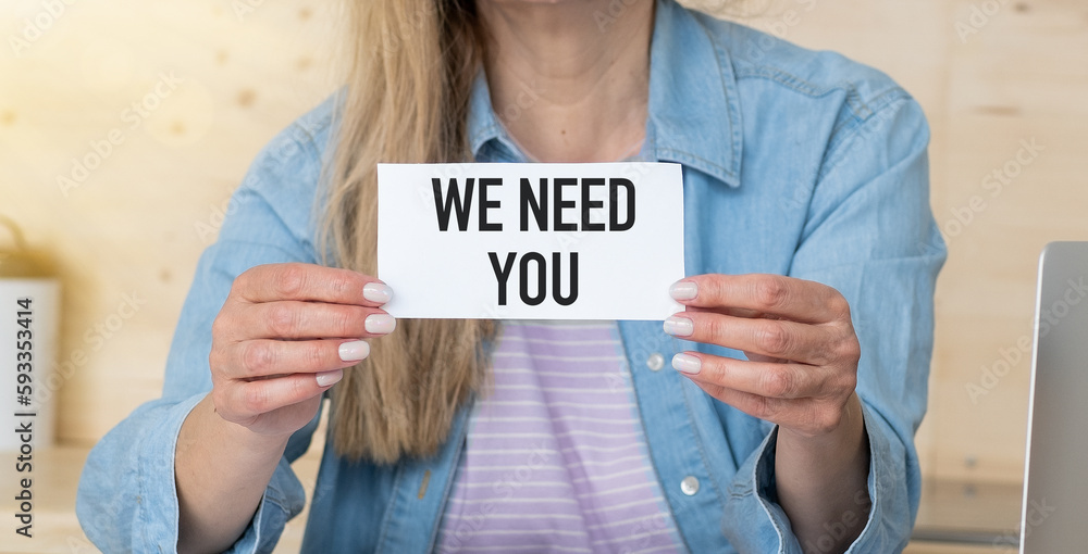We Need You message on the card shown by a businesswoman Stock Photo ...