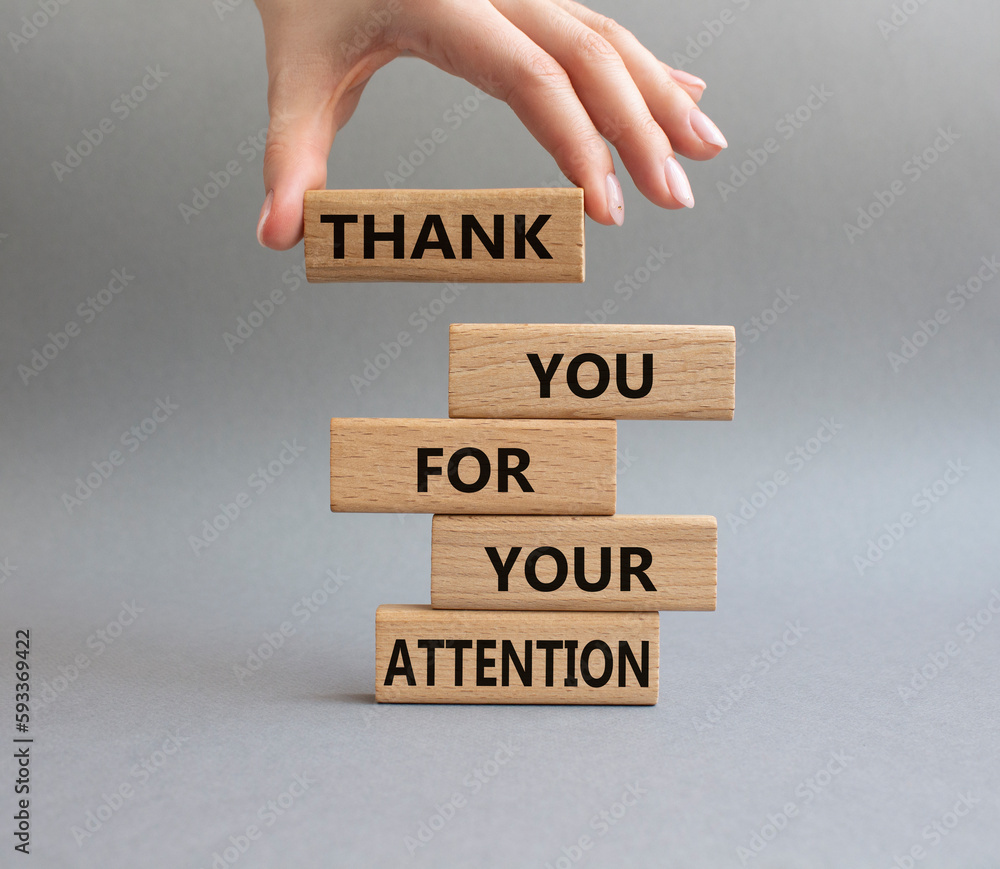 Attention symbol. Wooden blocks with words Thank you for your attention ...