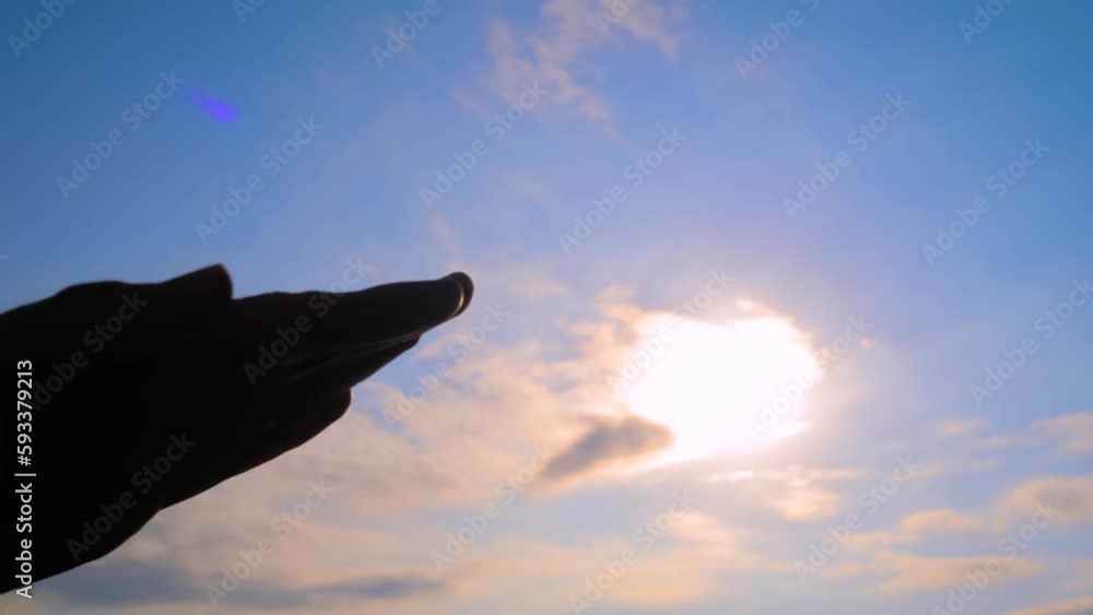 Silhouettes of woman and man are giving a high fives hand gesture ...