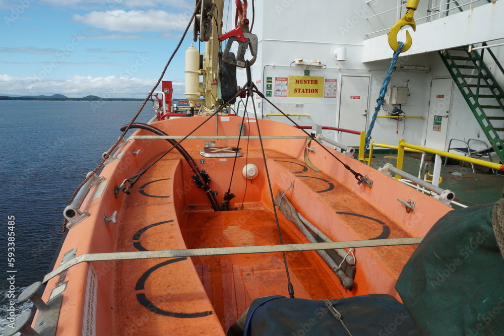 Orange rescue boat with outboard engine built from glass reinforced ...