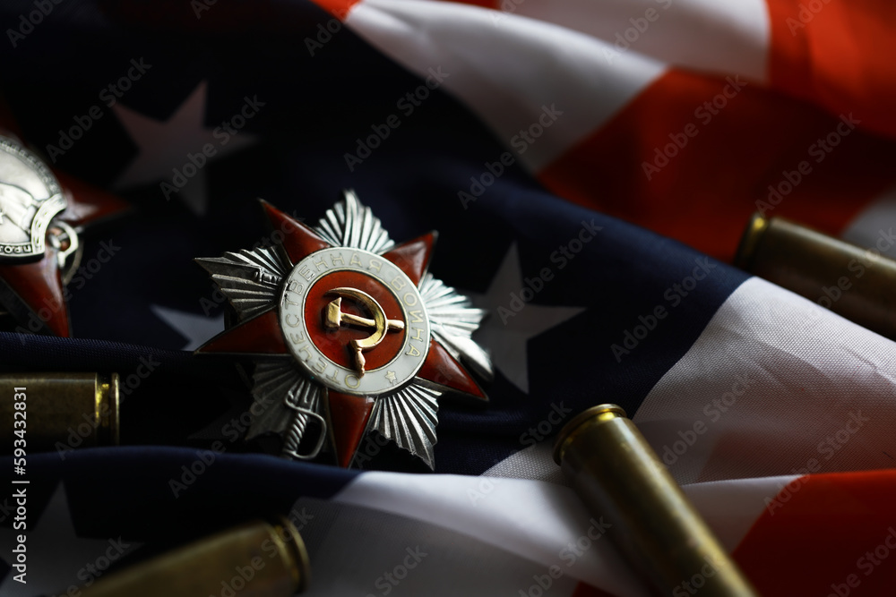Many bullets cartridges and medals on United States flag. Concept of ...