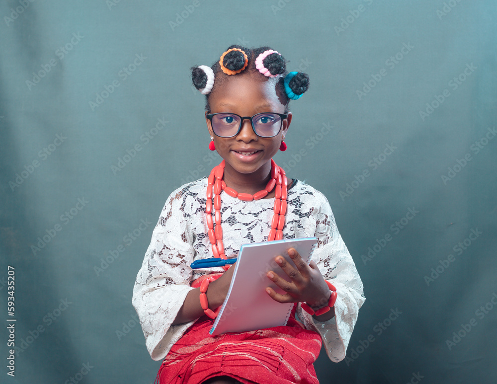 African Nigerian female girl child or student with eye glasses, wearing ...