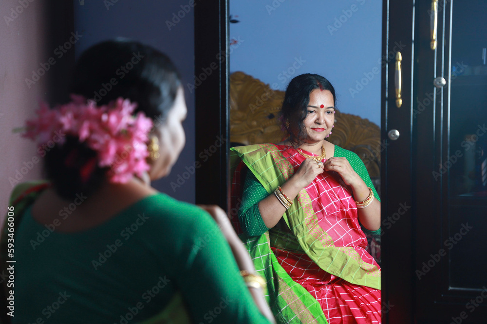 Indian middle aged hindu woman being prepared for a festive party ...