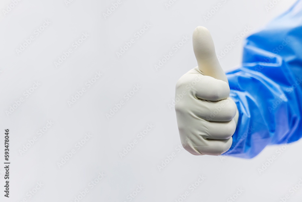 Doctor or surgeon in blue uniform do thumb up position in operating ...