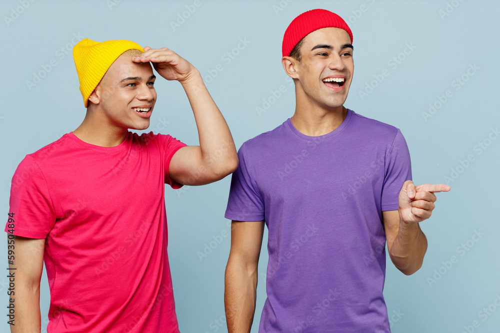 Young couple two friends men in casual clothes together point index ...