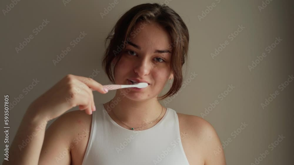 Teenage girl brushing teeth in bathroom at home. Dental care, hygiene ...