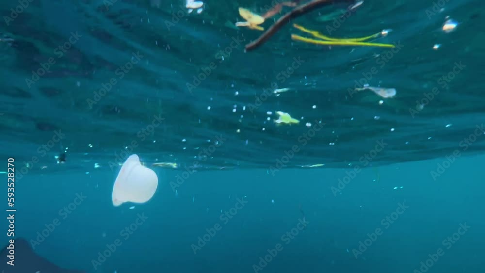 Stockvideon Plastic waste floating on surface of ocean seen from ...