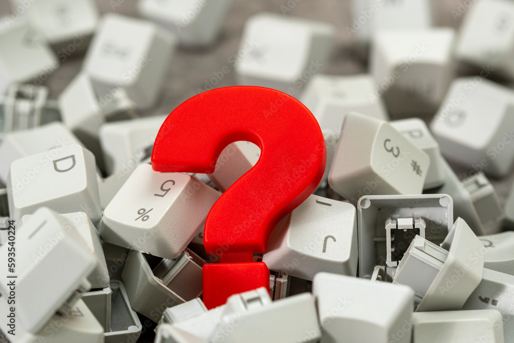 Foto de Red plastic question mark in the pile of computer keyboard keys ...