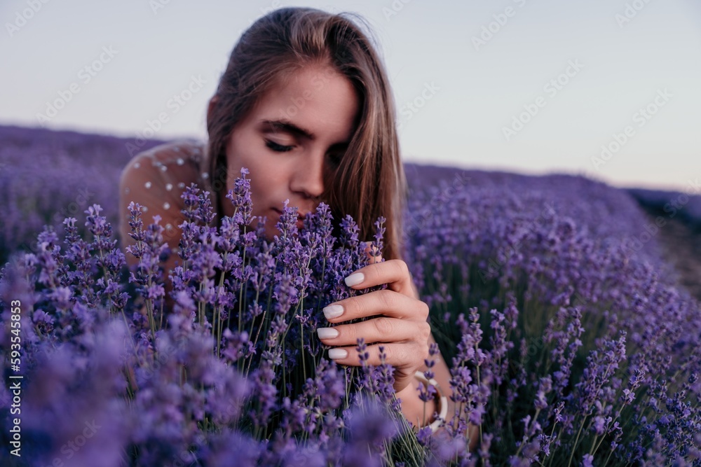 Woman lavender field. Happy carefree woman in beige dress and hat with ...