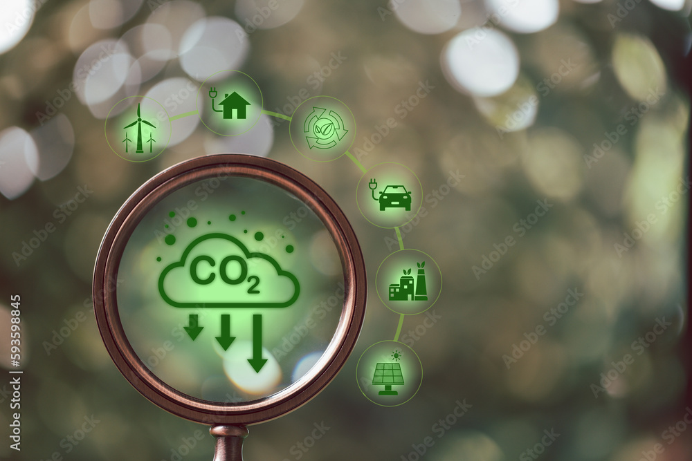 Magnifying glass with carbon reduction icon. Concept of reducing carbon ...