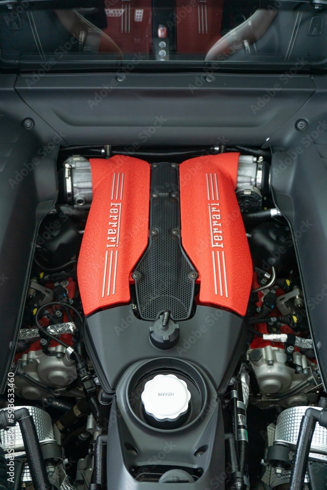 Vertical shot of a Ferrari 488 GTB Engine bay with red engine cover ...