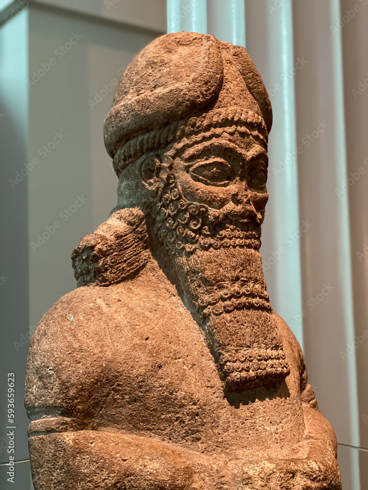 The British Museum in London, UK. Limestone statue of attendant god ...