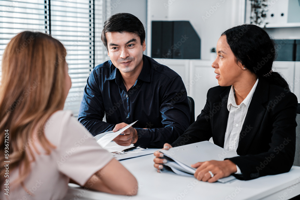A young female asian candidate tries to impress her interviewer by ...