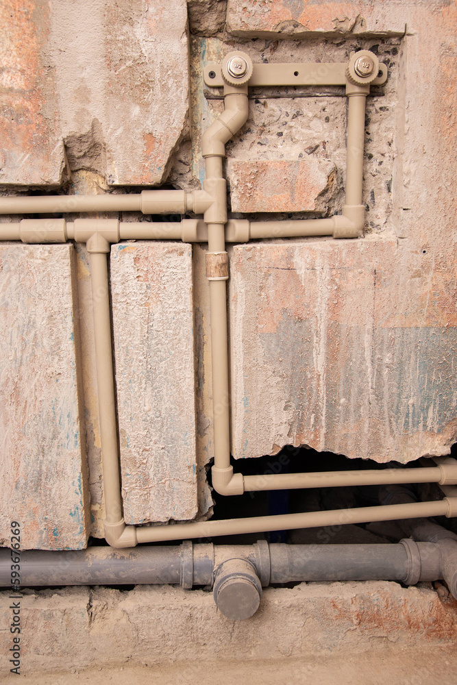 Transfer of water pipes and sewerage drain in the wall. Bathroom ...