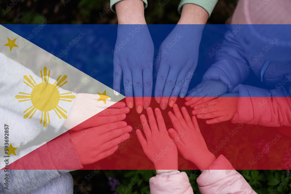 Hands of kids on background of Philippines flag. Filipino patriotism ...