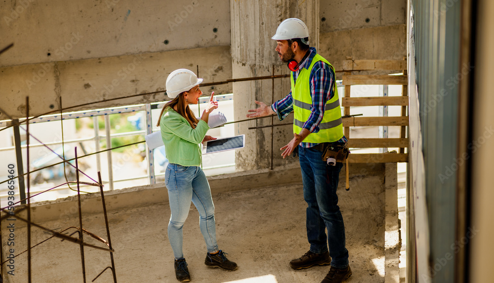 Architect and foreman meeting at construction site,Architect inspects ...