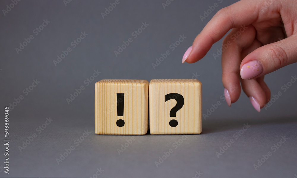 Question mark and exclamation mark symbol. Businessman hand is making a ...