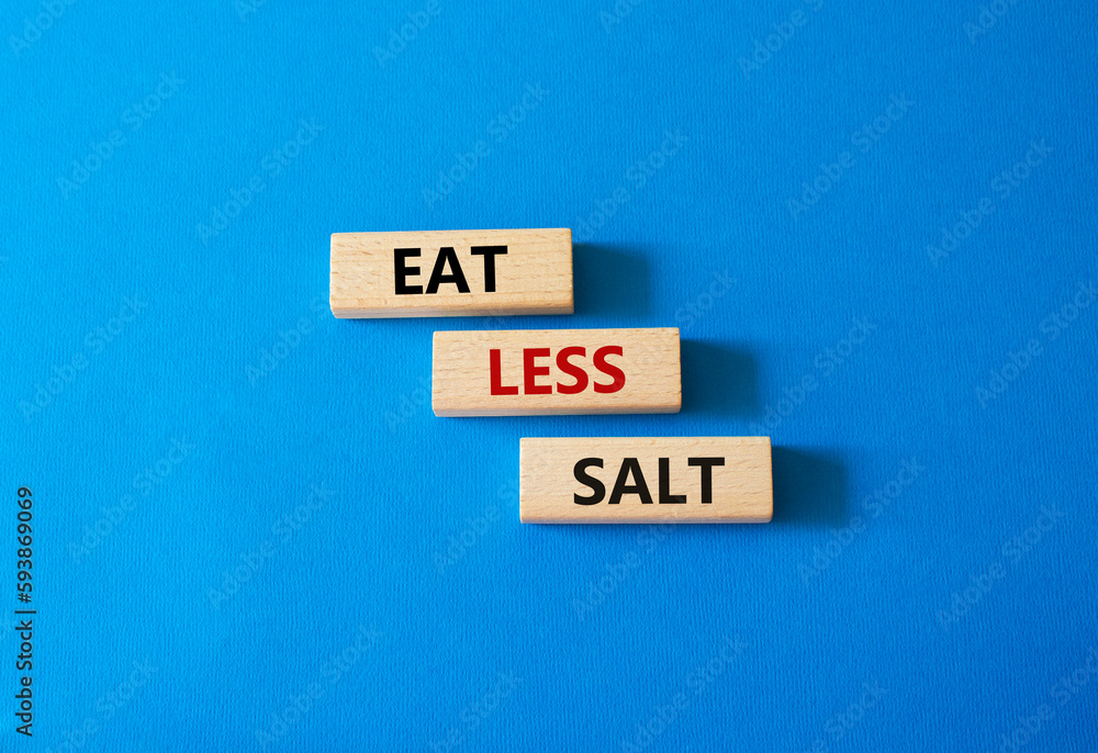 Eat less salt symbol. Concept word Eat less salt on wooden blocks ...