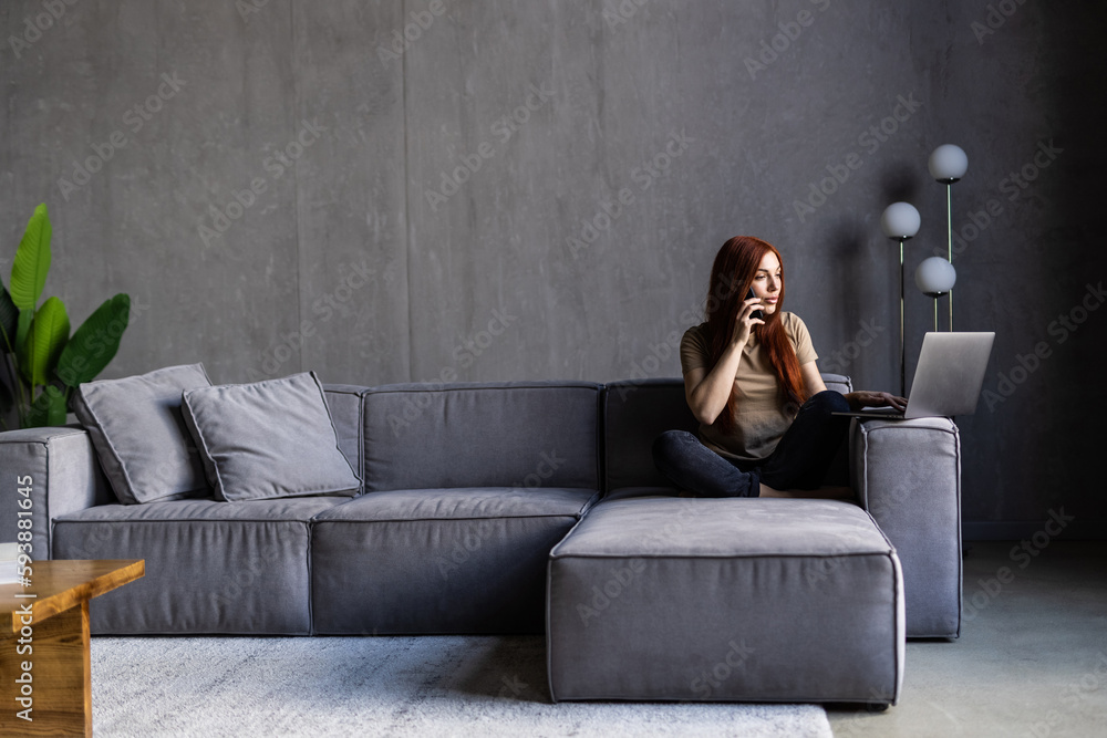 Phone conversation. Confident young woman sit on couch talk speak ...