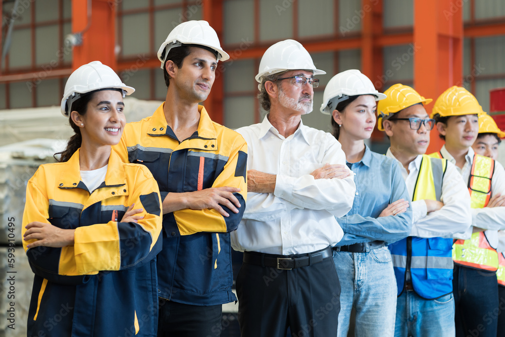 Fotka „Group of male and female factory workers standing together with ...