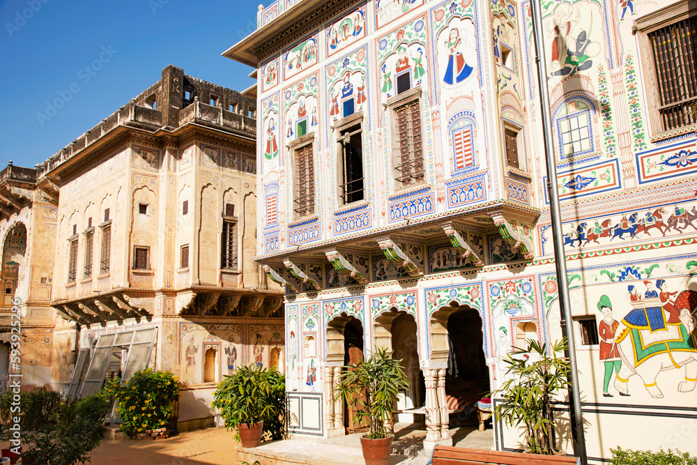 Colorful paintings and wooden windows on the outer wall of Seth ...