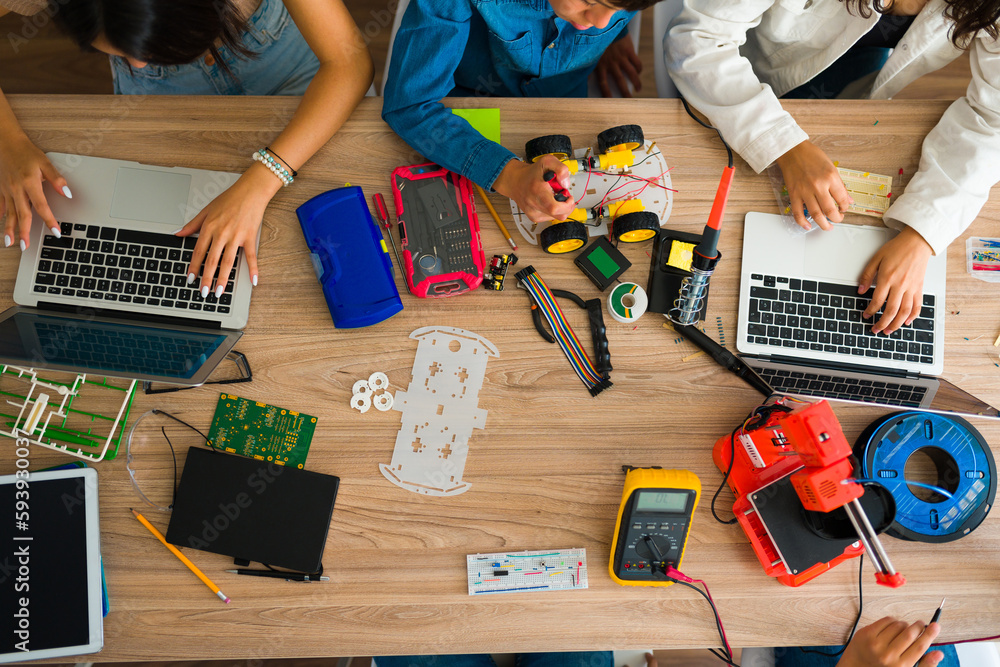 Photo & Art Print High angle of teen students learning about electronic ...
