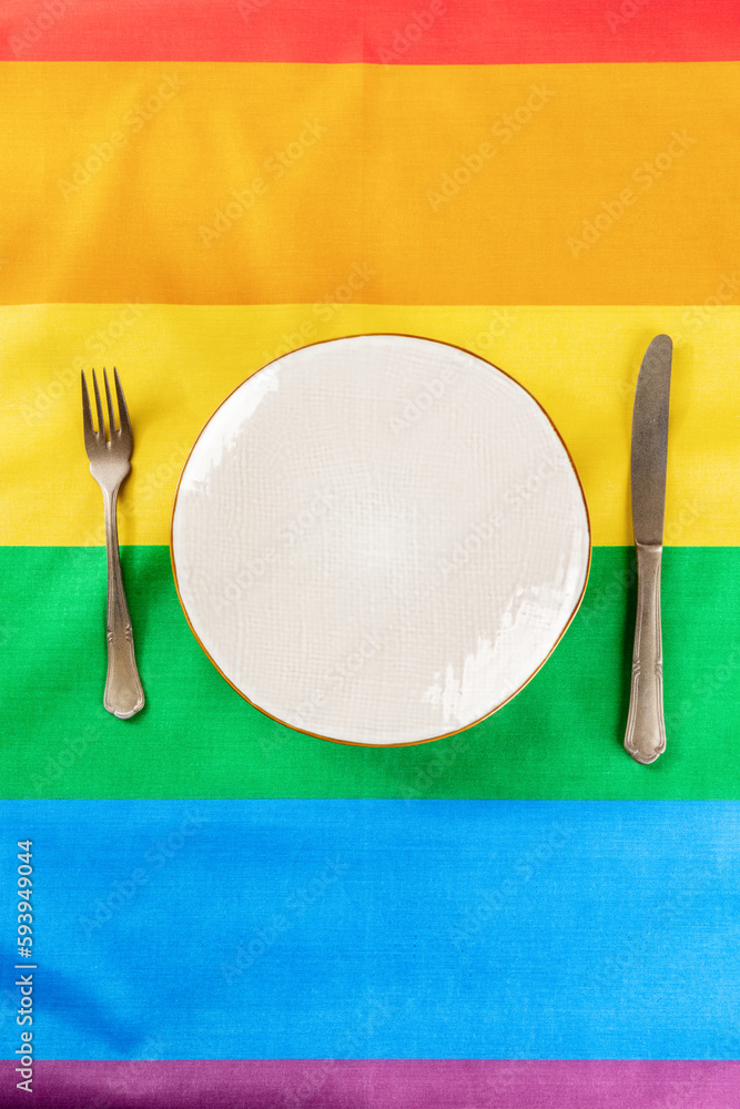 Gay dinner invitation design. A plate with cutlery, shot from the top ...