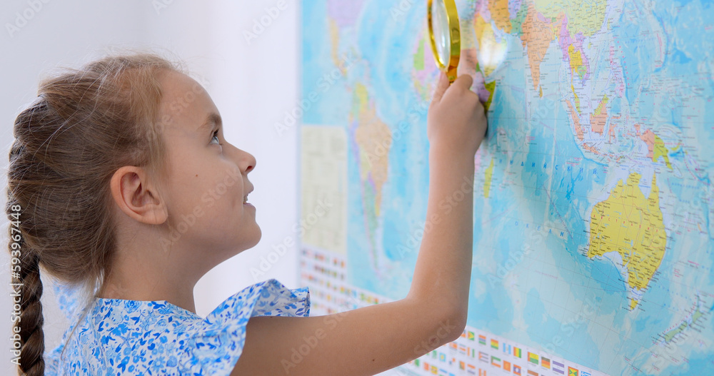 Little girl in dress studying Earth map, education knowledge learning ...